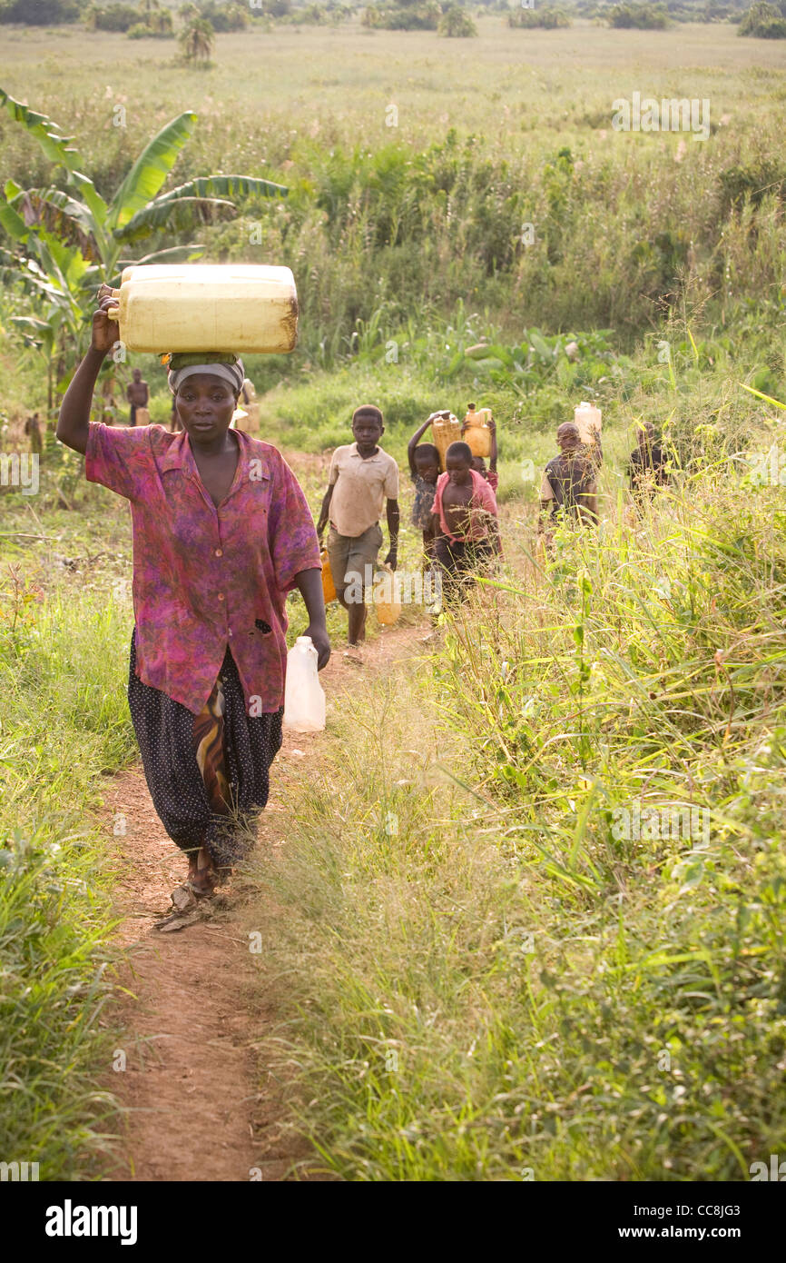 A woman fetches water in rural Masaka District, Uganda, East Africa ...