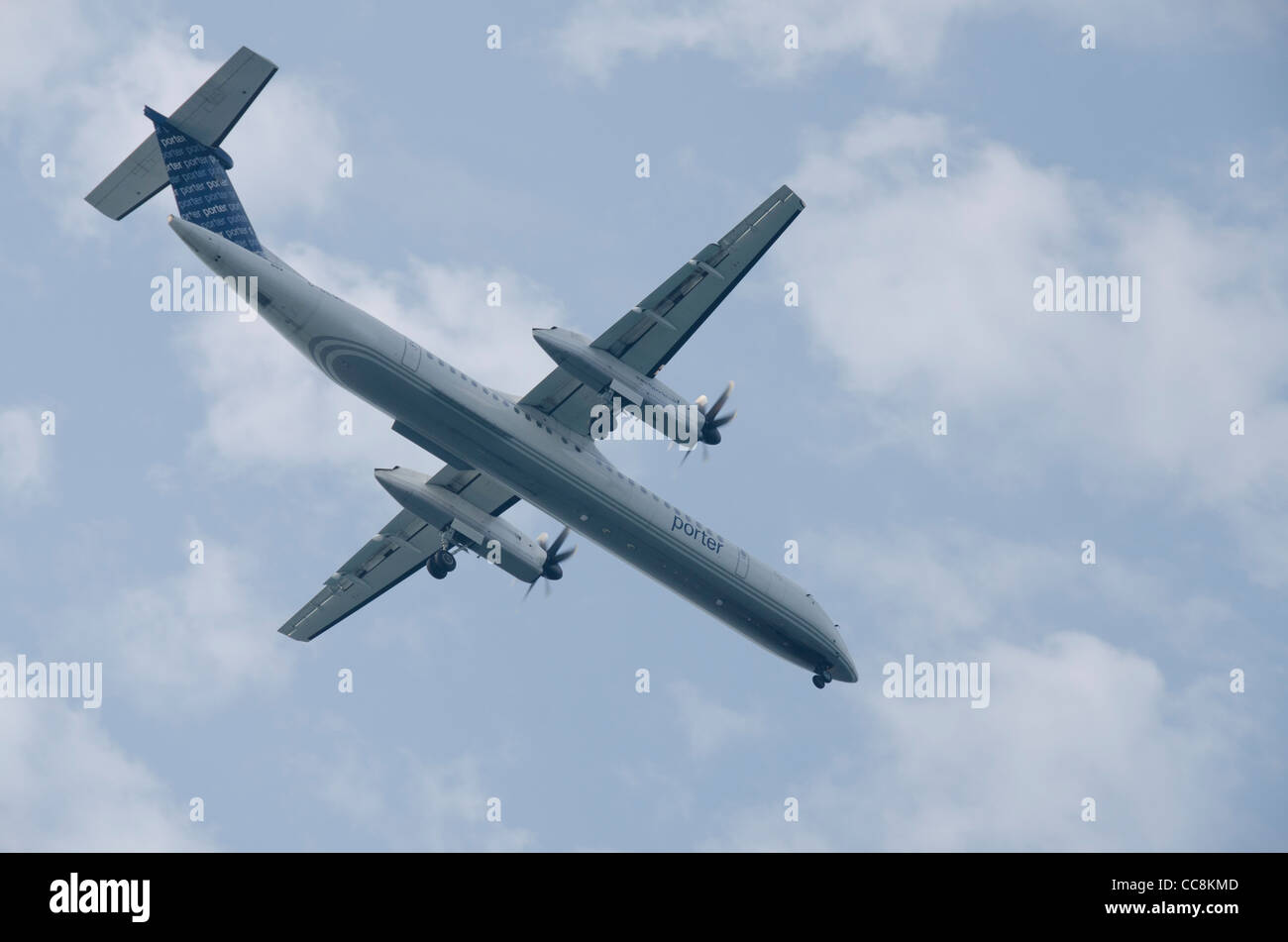 Canada, Ontario, Toronto. Porter commuter prop airplane in flight Stock ...