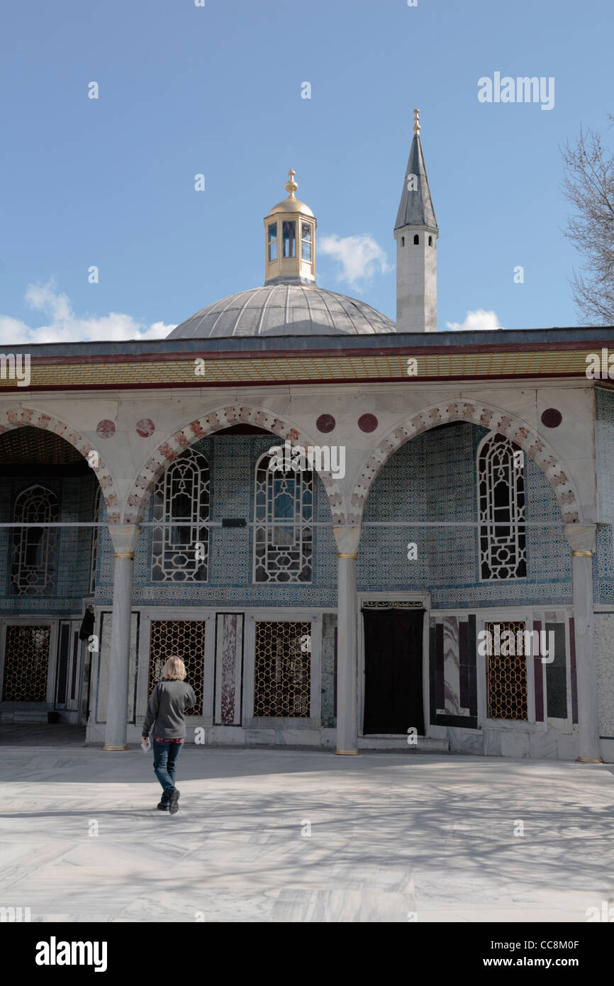 female Tourist exploring the Topkapi Palace Istanbul Dome and minaret ...