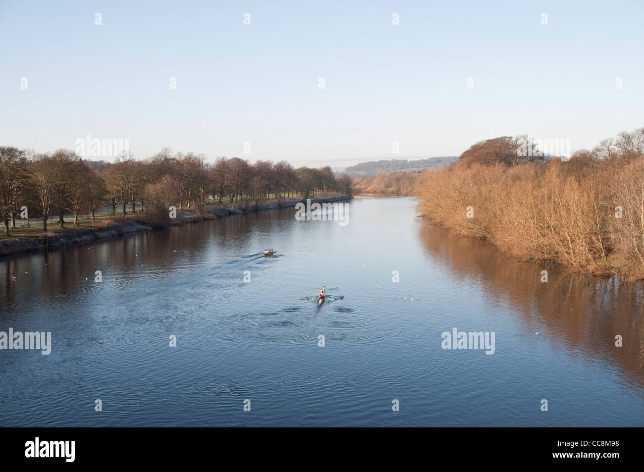 Looking West from the bridge over the River Tyne at Hexham, with rowers ...