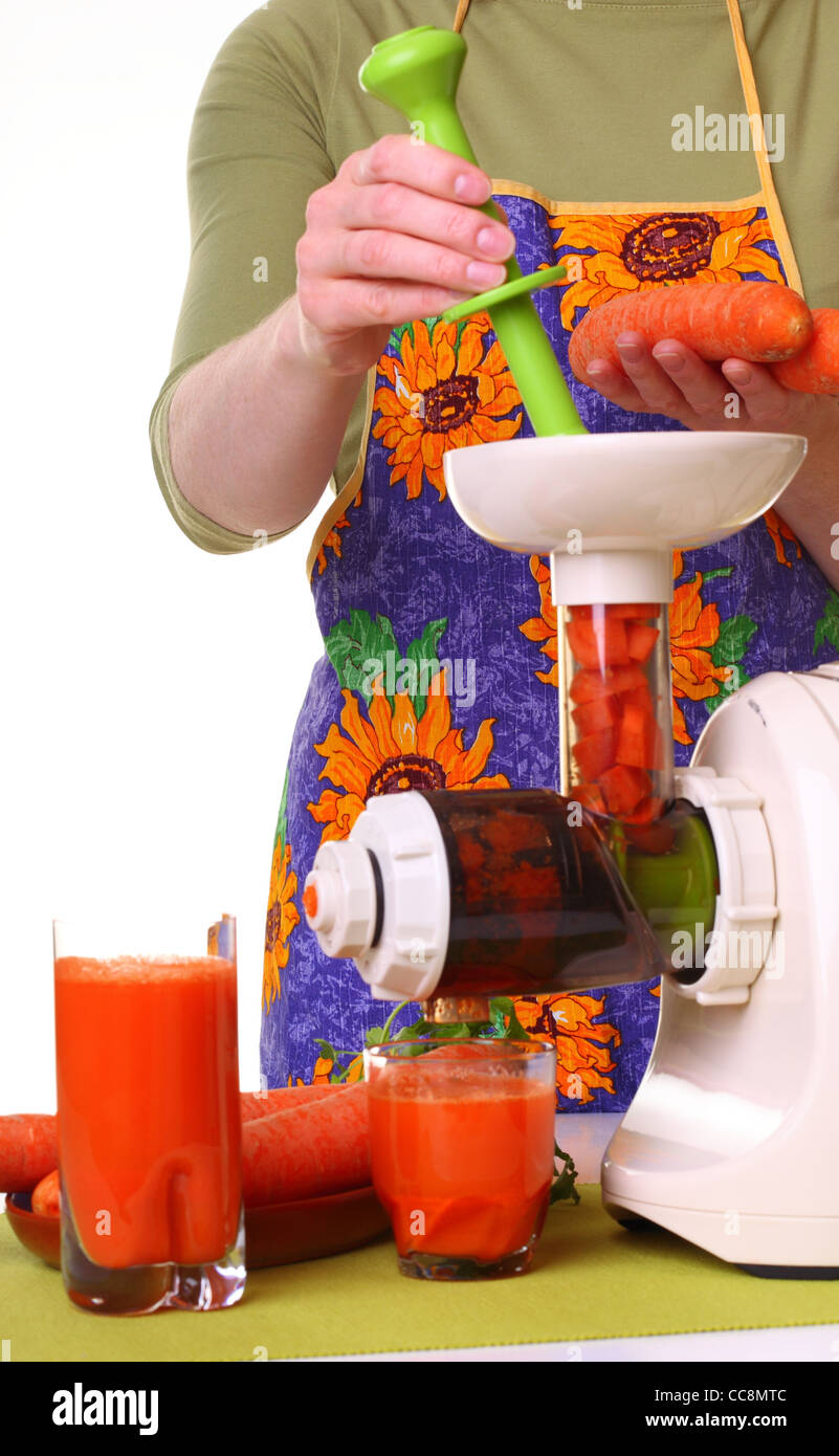 Woman Juice extractor and carrot isolated white kitchen prepare Stock ...