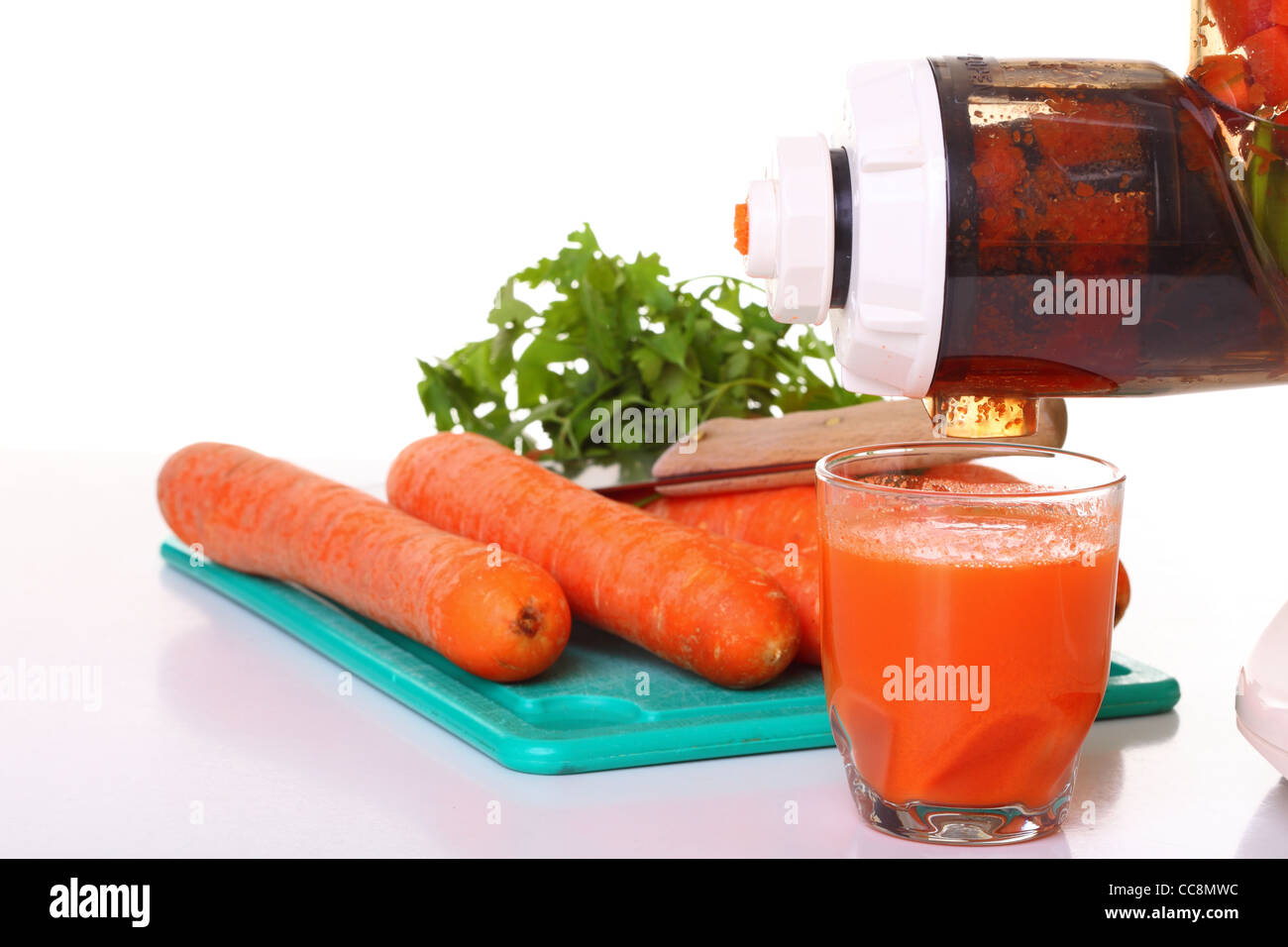 Juice extractor and carrot isolated white kitchen prepare Stock Photo ...