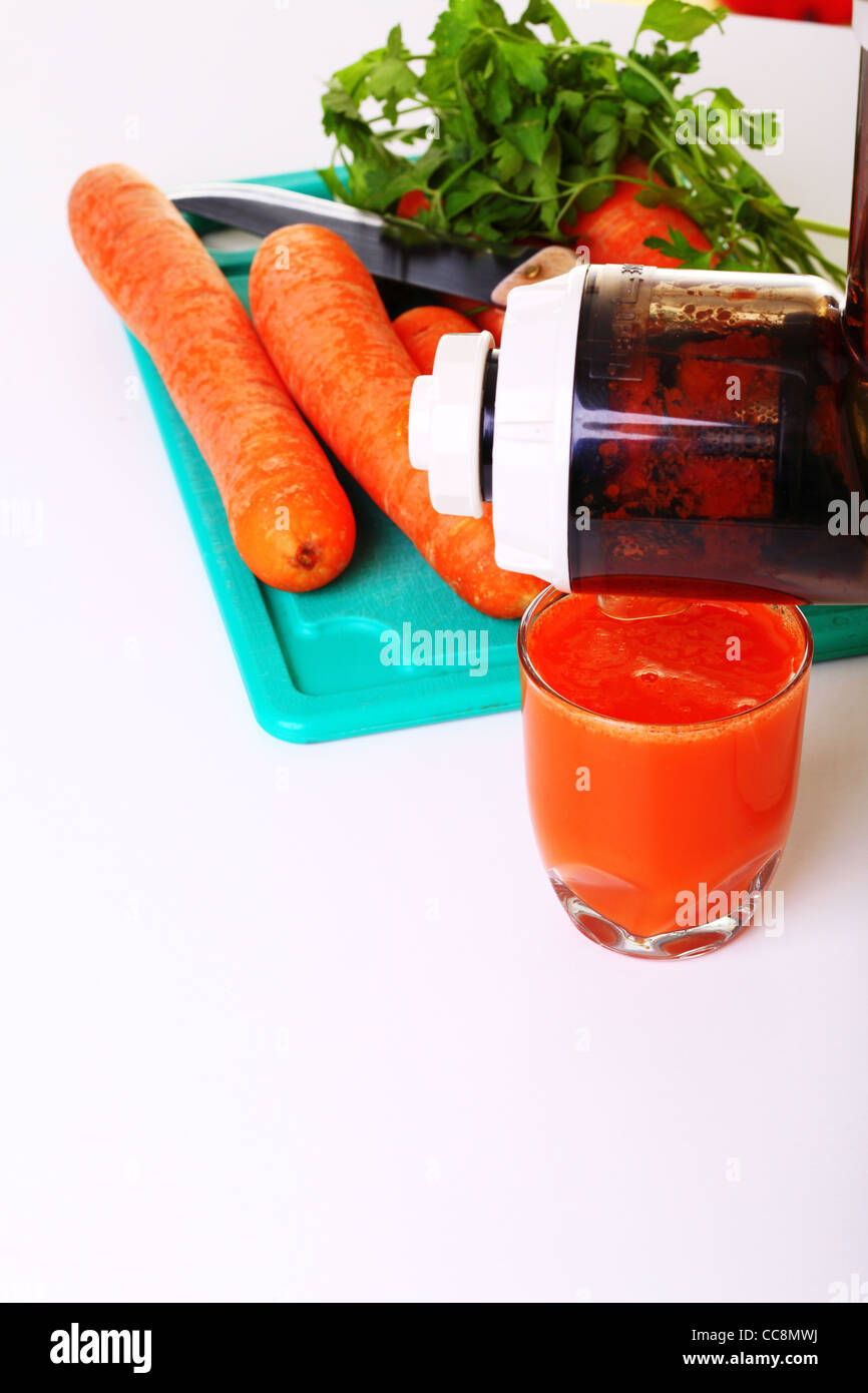 Juice extractor and carrot isolated white kitchen prepare Stock Photo ...