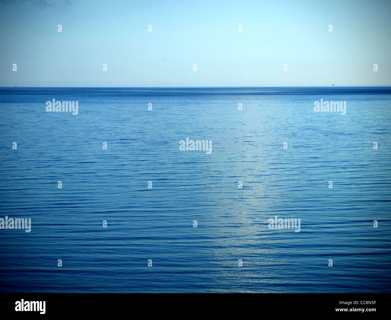 Blue sea using as background Stock Photo - Alamy