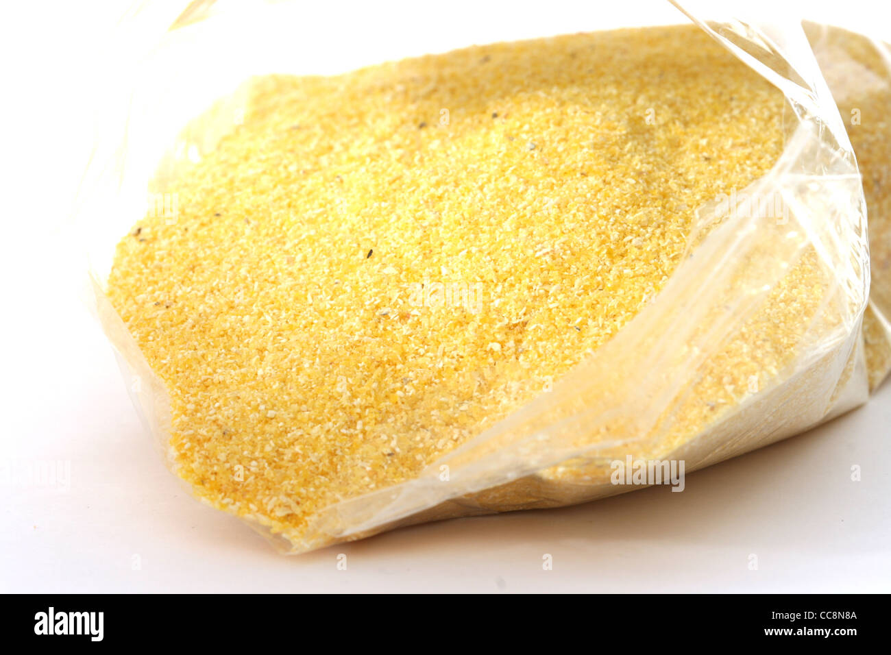 Yellow corn flour in a bag on white background Stock Photo - Alamy