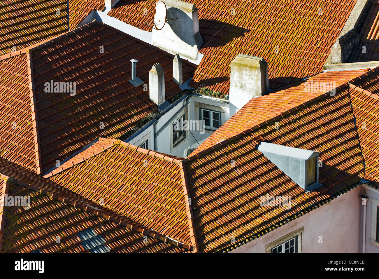 roof covered with red tiles, narrow well Stock Photo - Alamy