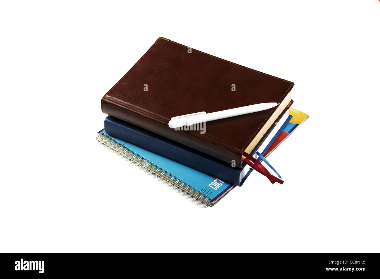 two diary with pen , on white background Stock Photo - Alamy