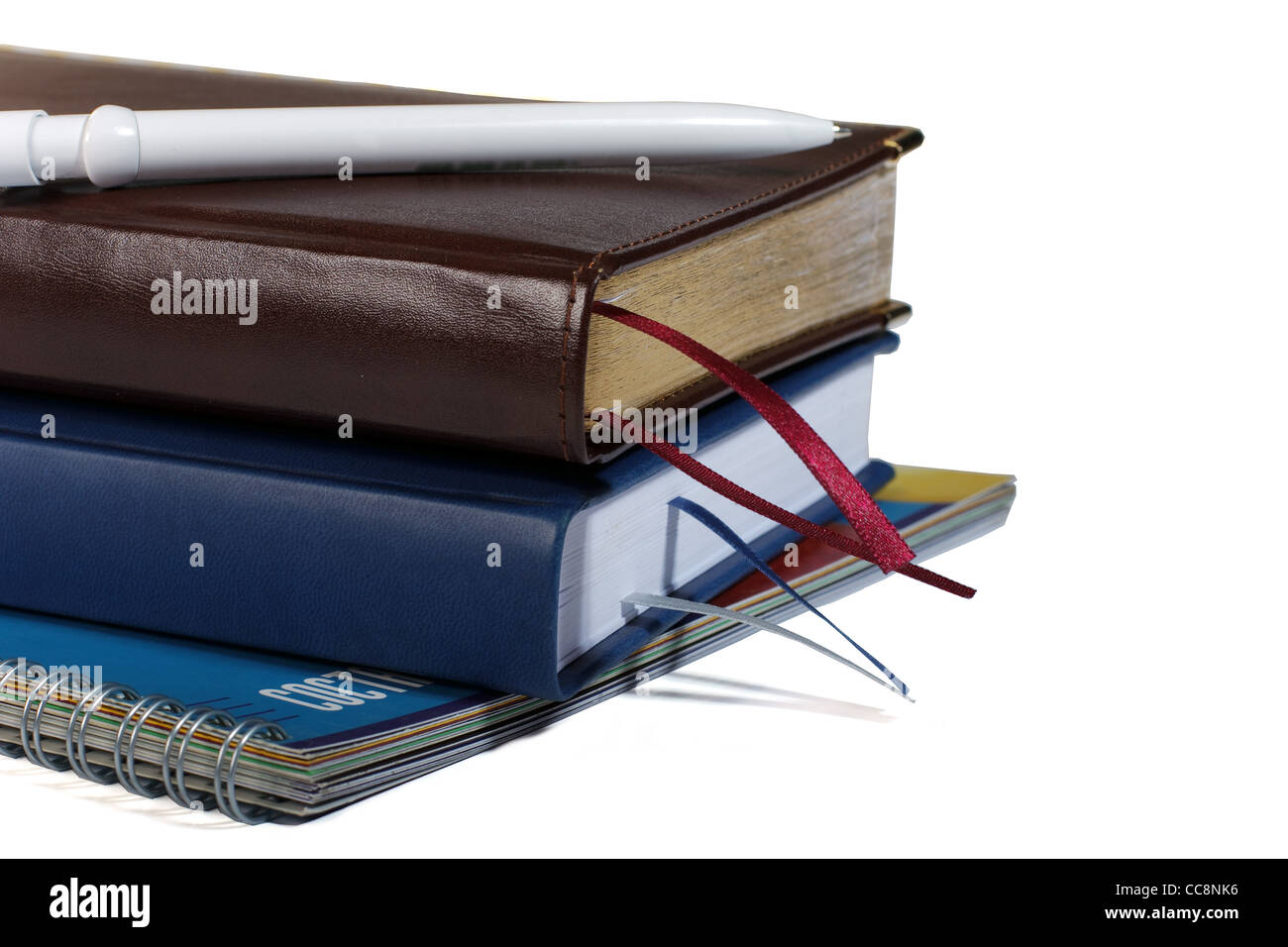 two diary with pen , on white background Stock Photo - Alamy