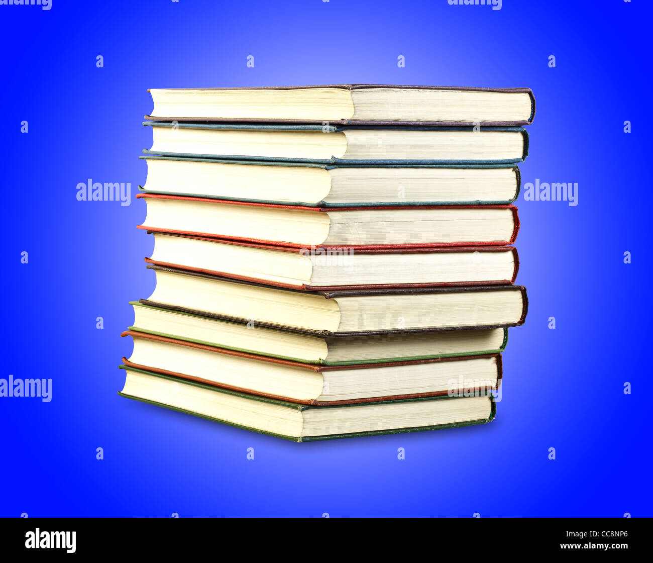 a stack of old books in the blue, isolated Stock Photo - Alamy