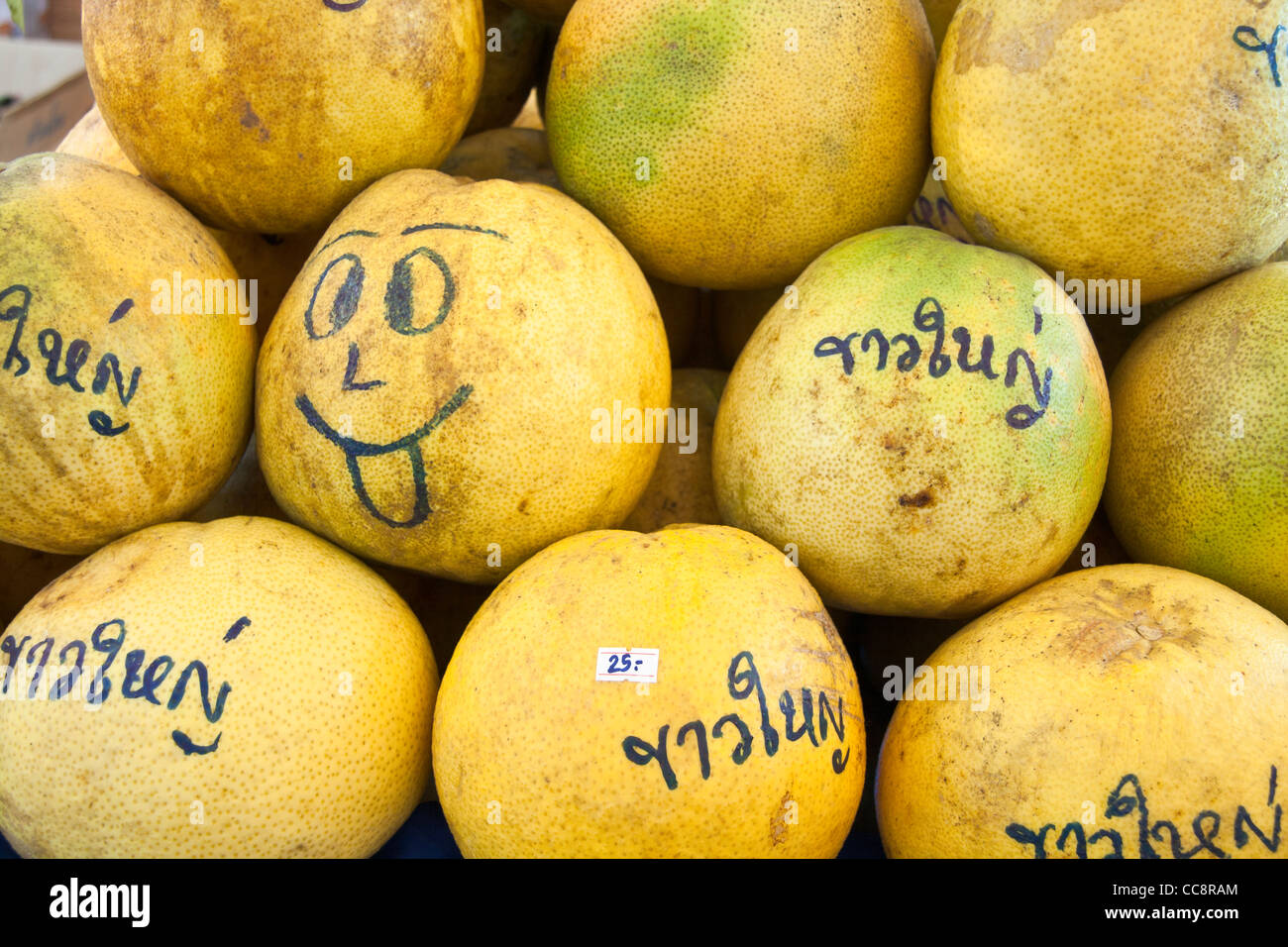 Pomelos on display at a market in Thailand Stock Photo - Alamy