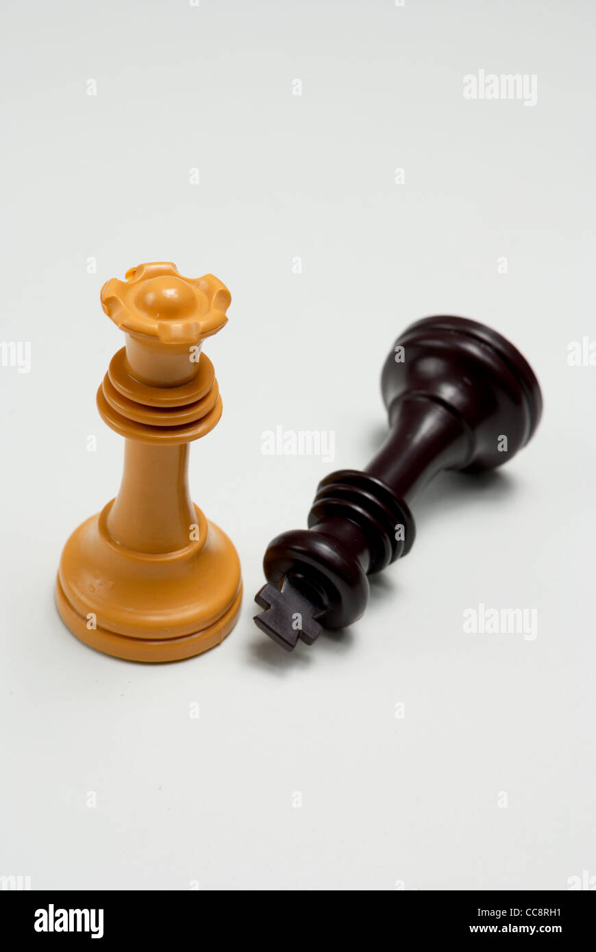 Queen defeats king, a female power concept Stock Photo - Alamy