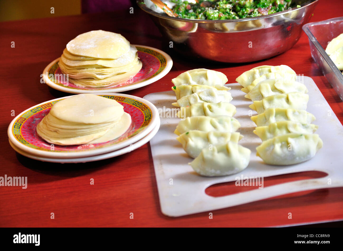 Making traditional dim sum Chinese dumplings in kitchen, China Stock ...