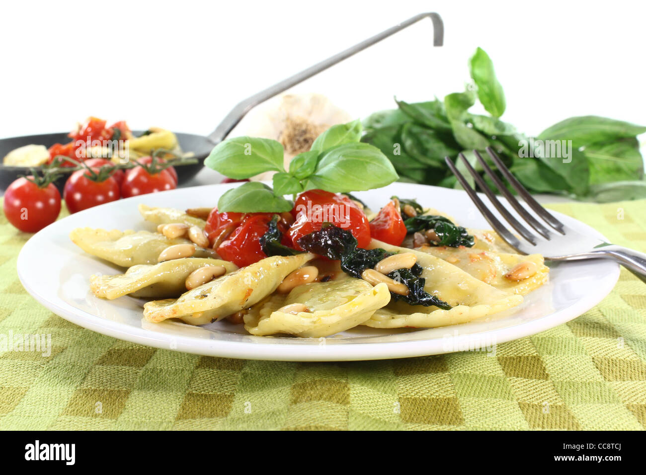 Rocket and Ricotta Cappelletti with pine nuts, tomatoes and fresh basil ...