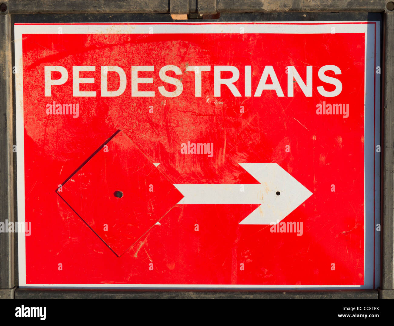 Pedestrians this way sign informing people which way to walk Stock ...