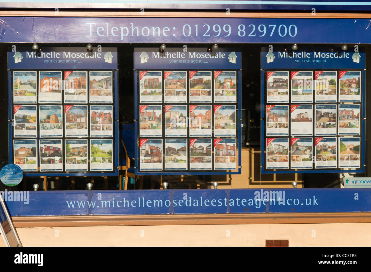 Estate agents shop window Stock Photo - Alamy