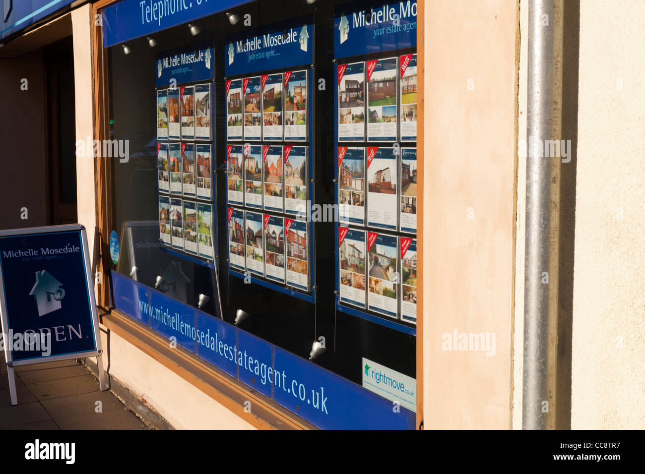 Estate agents shop window Stock Photo - Alamy