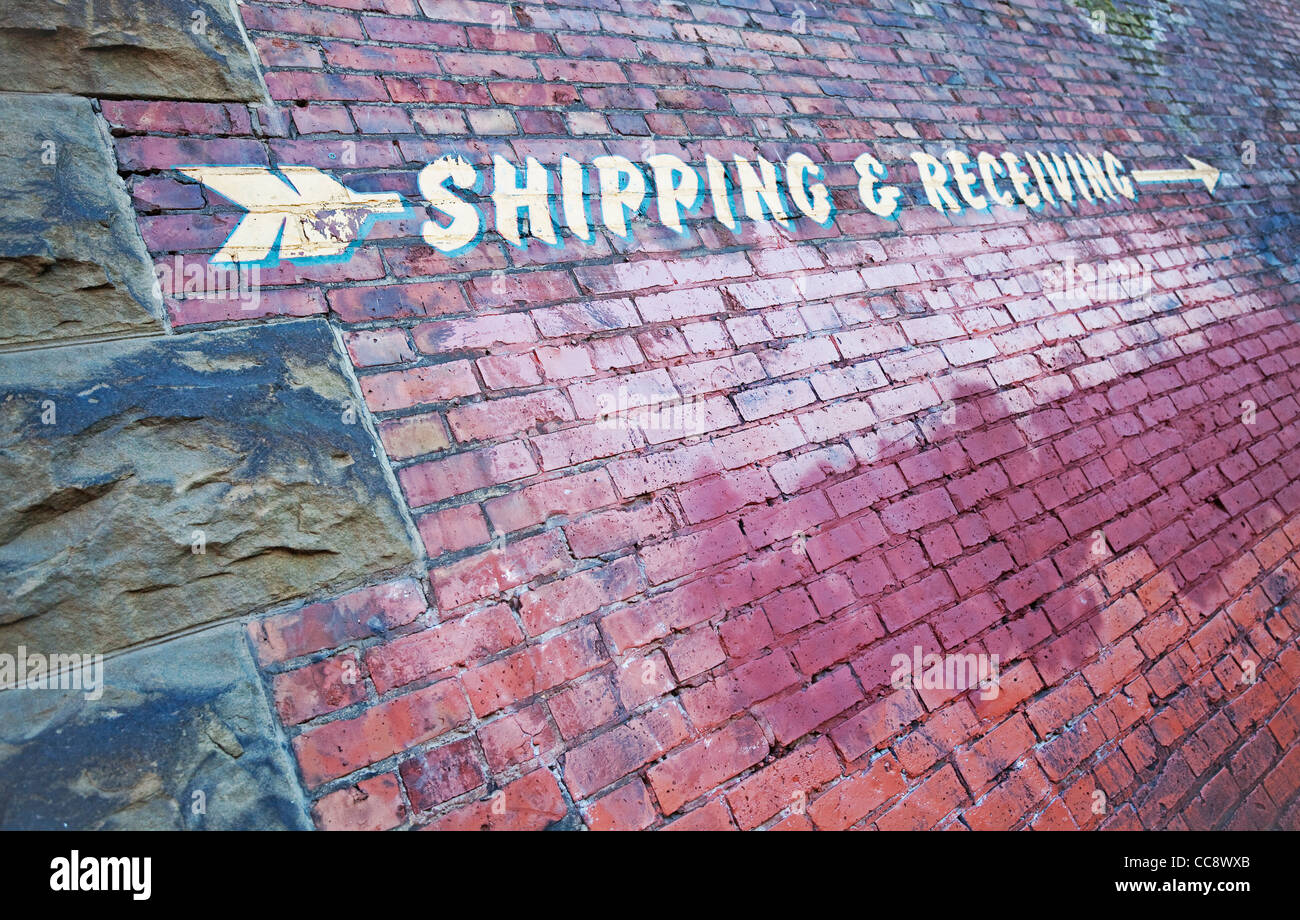 shipping and receiving sign painted on wall Stock Photo - Alamy