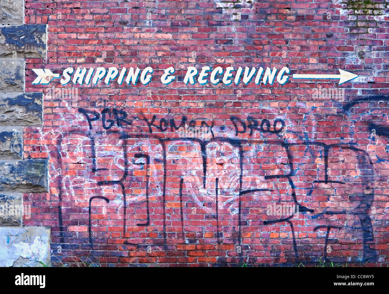 shipping and receiving sign on graffiti covered wall Stock Photo - Alamy