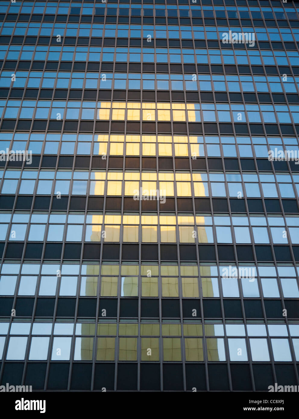 Glass building in Manchester showing reflections. Portland Tower ...