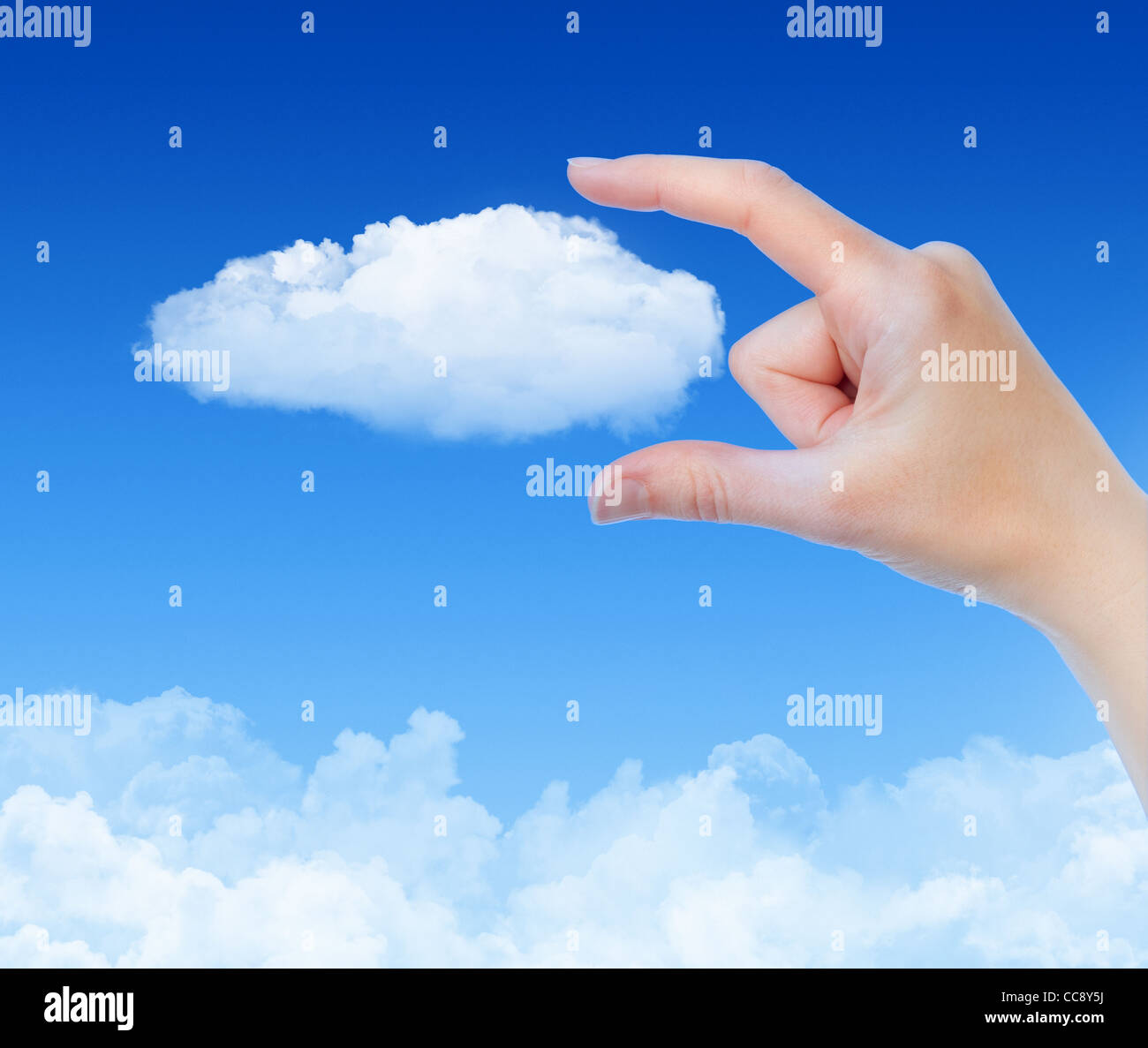 Woman hand measures the cloud against blue sky with clouds. Concept ...