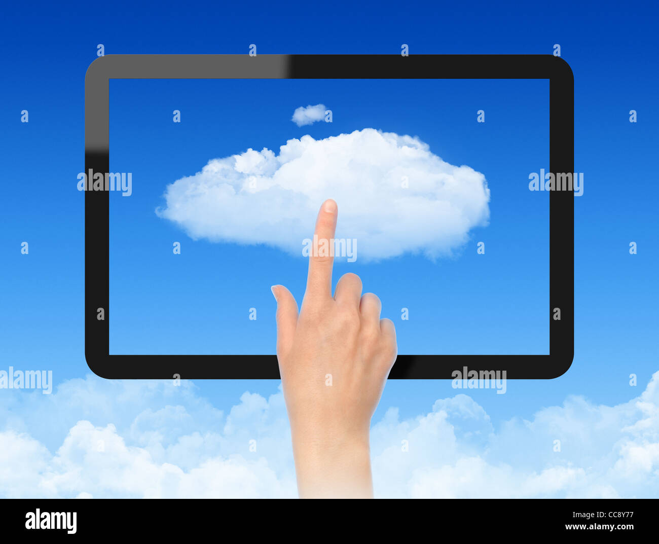Woman hand touch the cloud against blue sky with clouds. Concept image ...