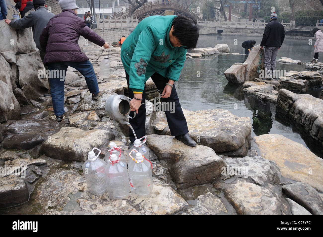 Collecting spring water Stock Photo - Alamy