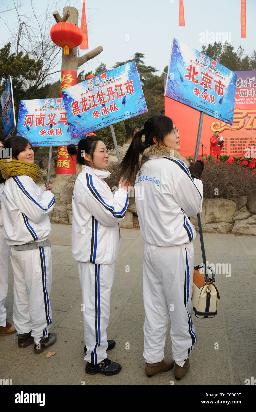 Country placards at a winter swimming race in China Stock Photo - Alamy
