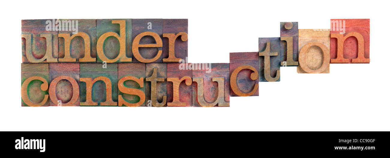 under construction words in vintage wooden letterpress type blocks ...