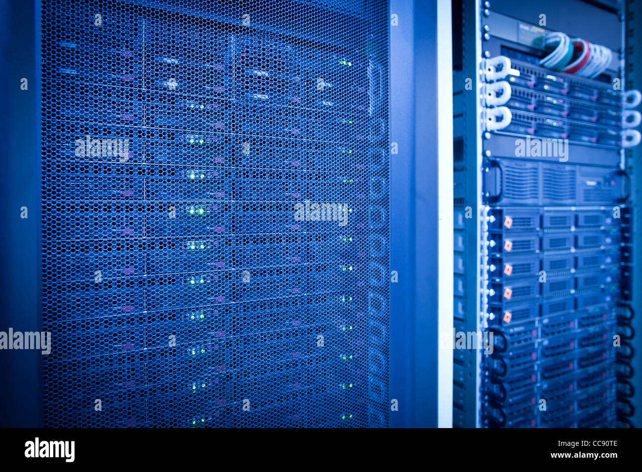 Server rack cluster in a data center (shallow DOF; color toned image ...