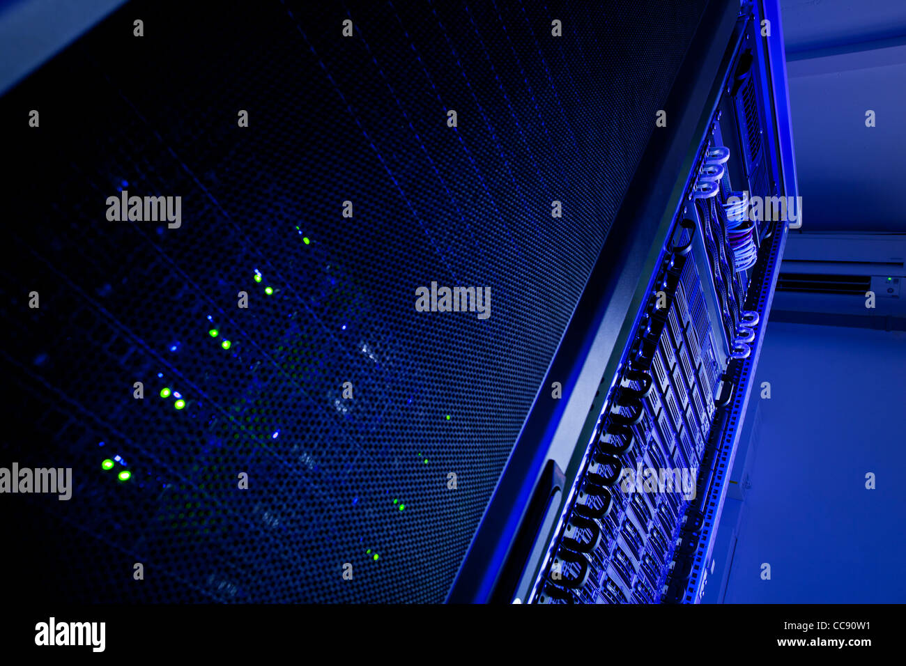 Server rack cluster in a data center (shallow DOF; color toned image ...