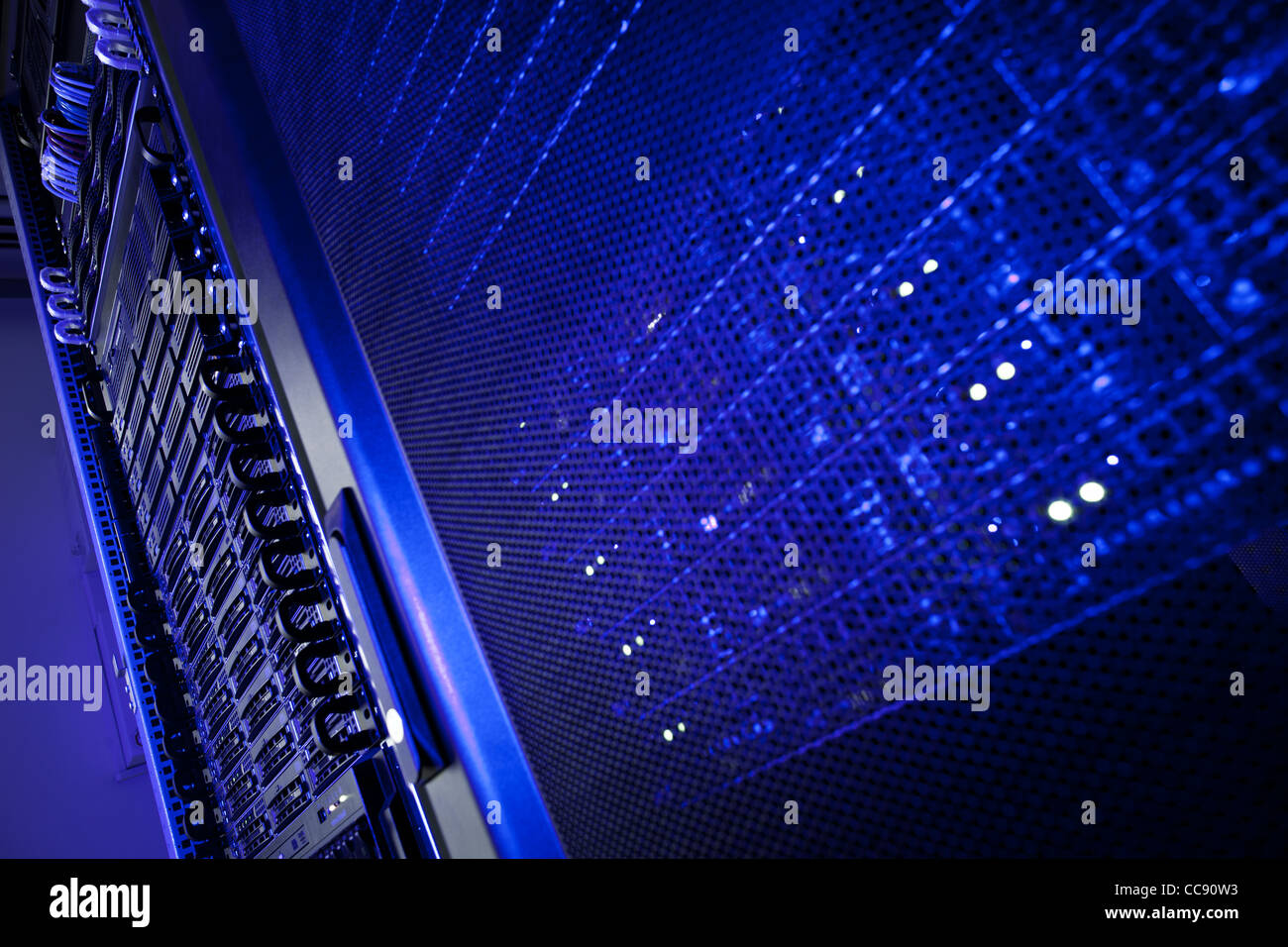 Server rack cluster in a data center (shallow DOF; color toned image ...