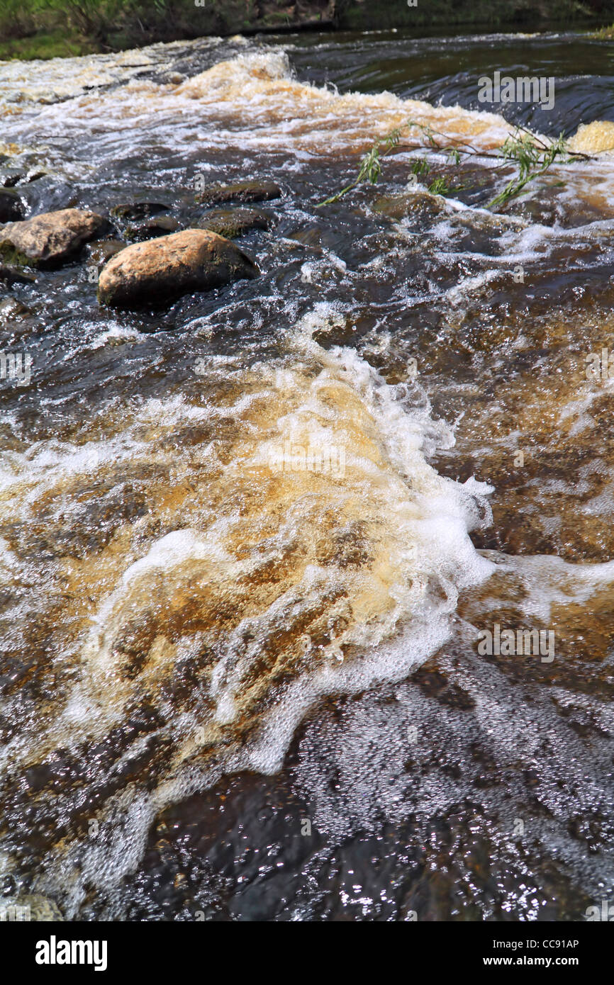river flow amongst stone Stock Photo - Alamy