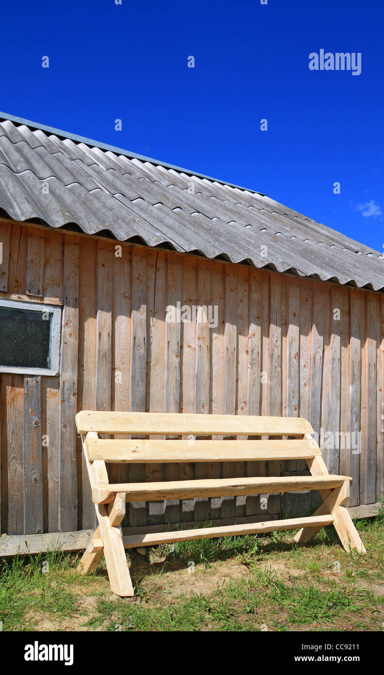 wooden bench near wooden wall Stock Photo - Alamy