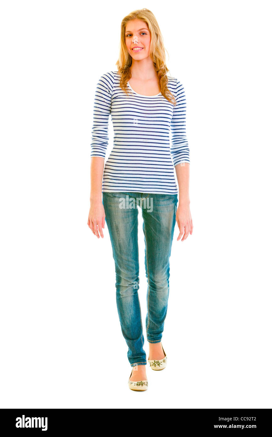 Smiling beautiful teen girl making step Stock Photo - Alamy