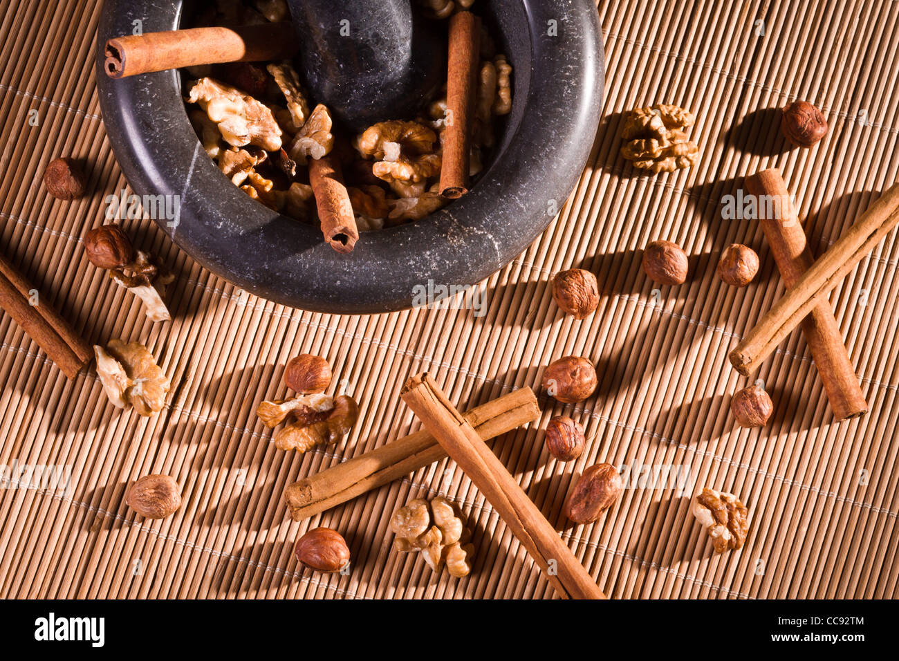 Dark mortar and all sorts of nuts Stock Photo - Alamy