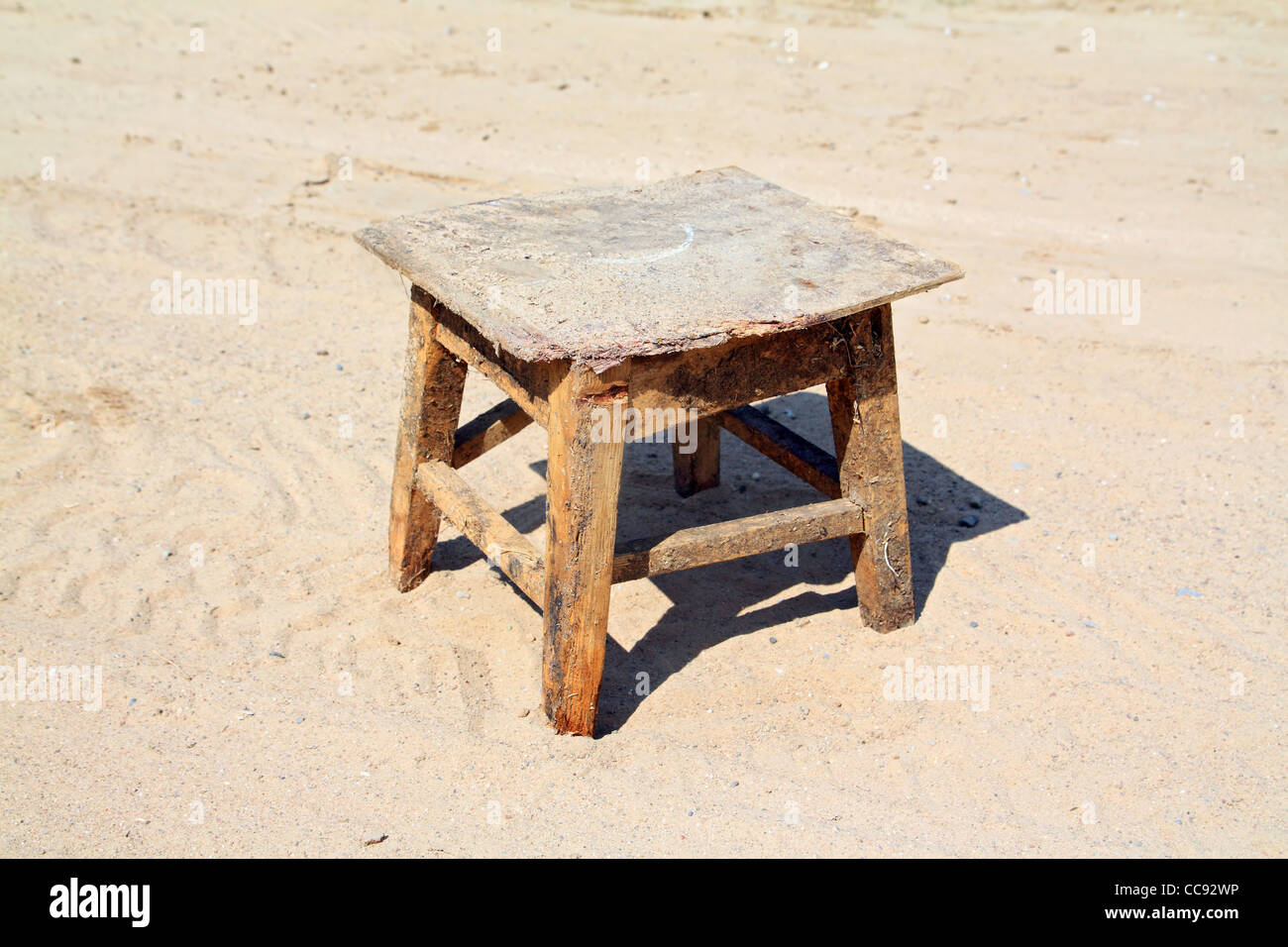old stool on sandy road Stock Photo - Alamy