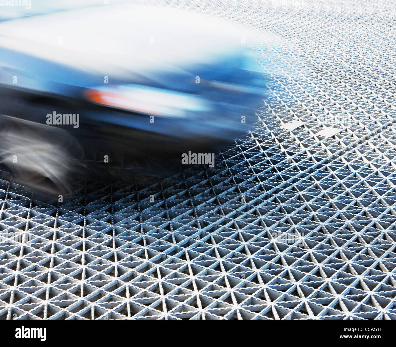 car crossing grating on bridge Stock Photo - Alamy