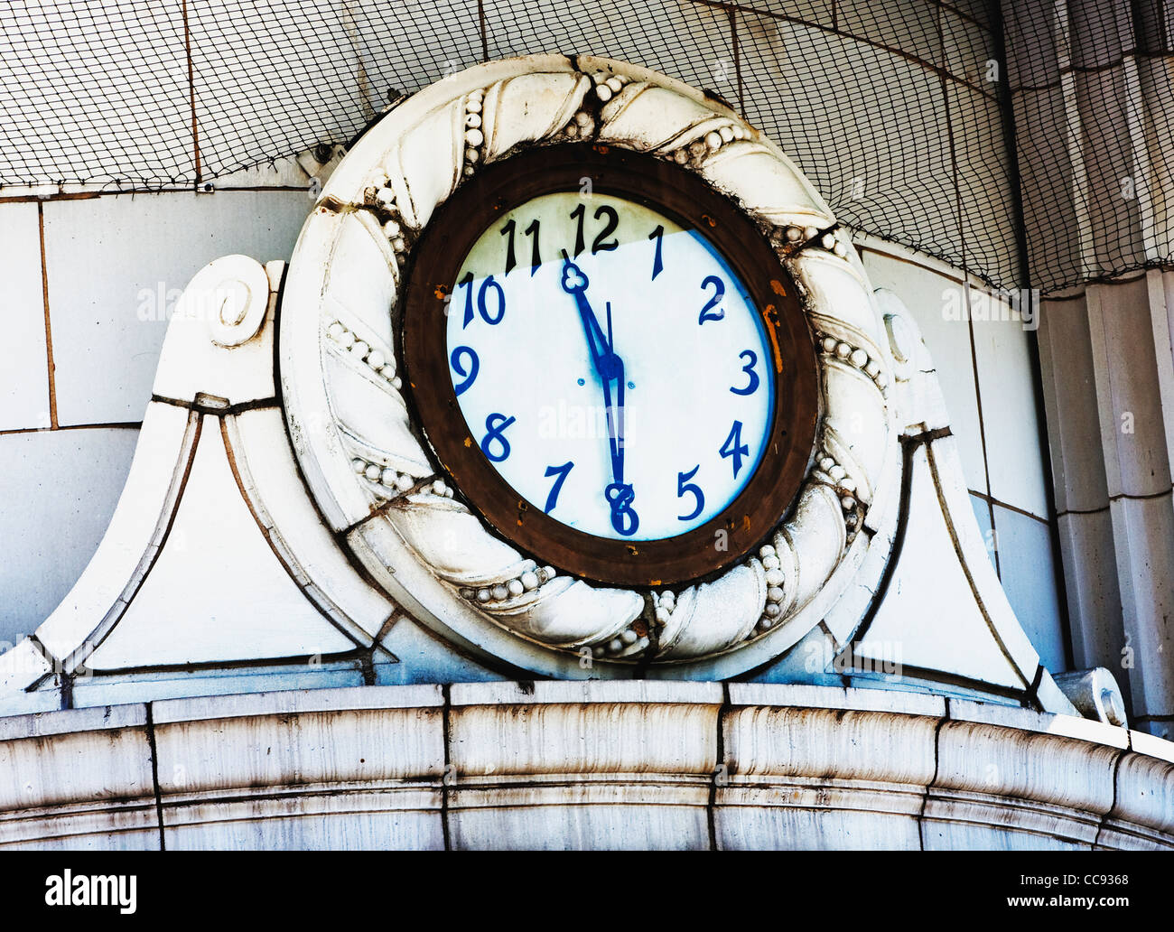 clock above building entrance Stock Photo - Alamy