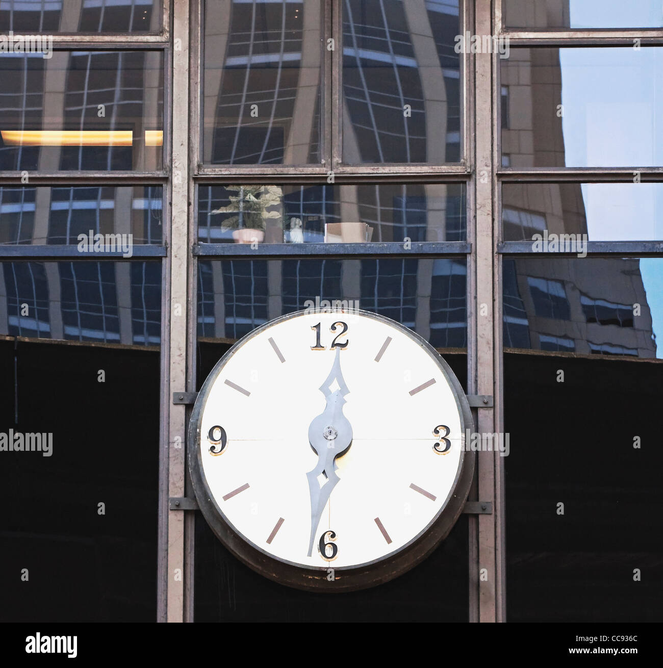 clock above building entrance Stock Photo - Alamy