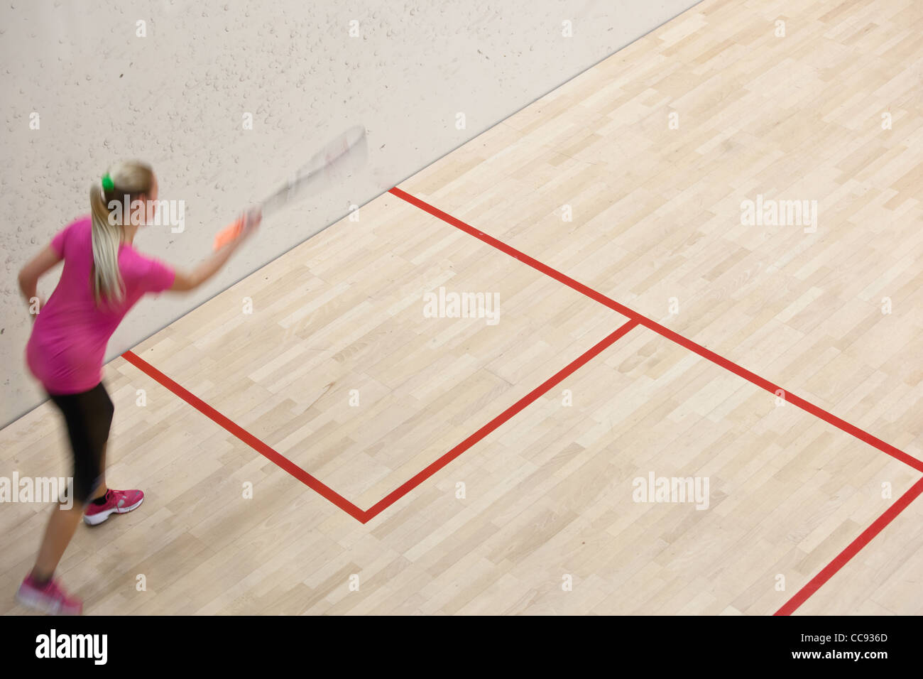 Two female squash players on a squash court Stock Photo - Alamy