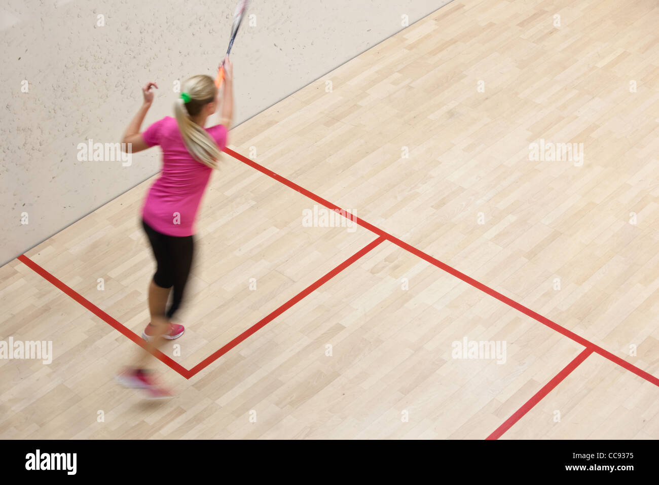 Two female squash players on a squash court Stock Photo - Alamy