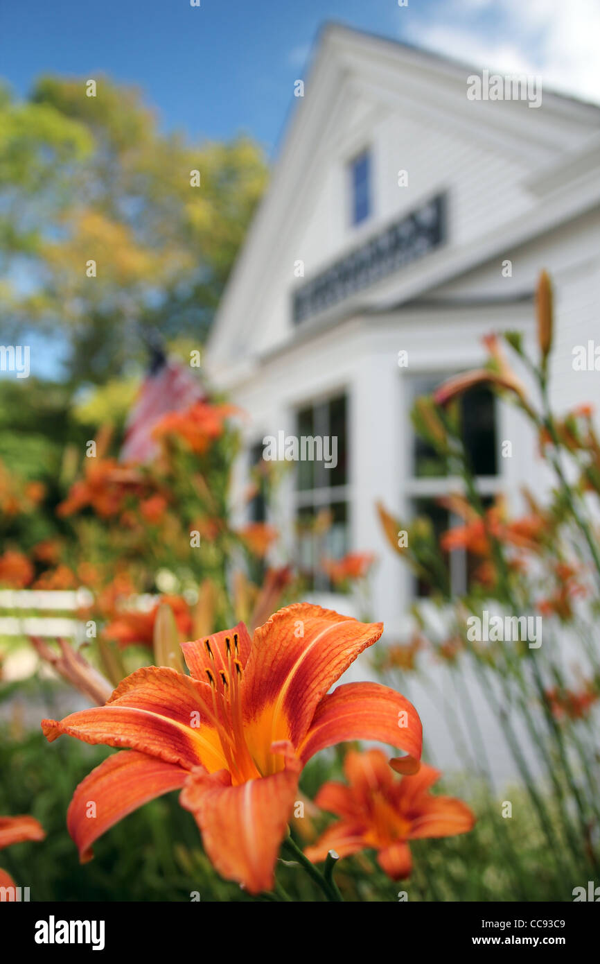 Flowers in front of an old Cape Cod building that housed a boot shop ...