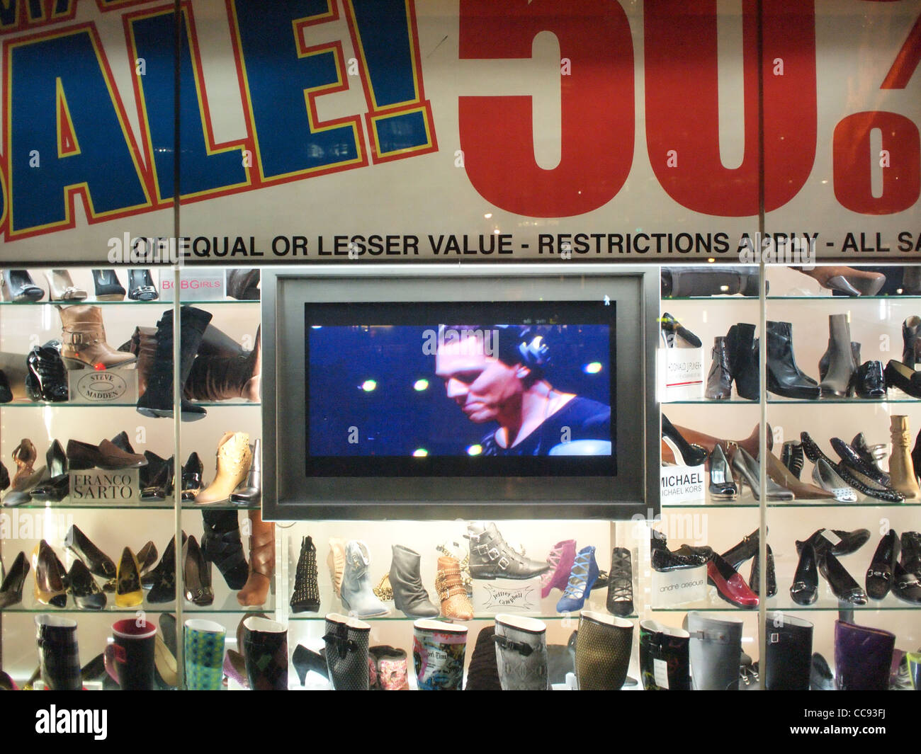 Window of shoe store with video display, New York City Stock Photo - Alamy