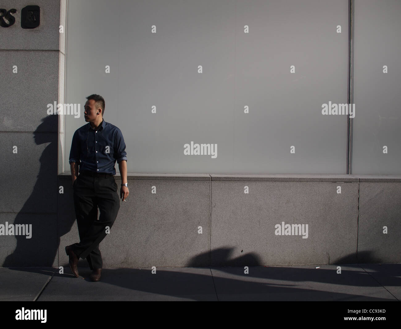 Man smoking in shadows hi-res stock photography and images - Alamy