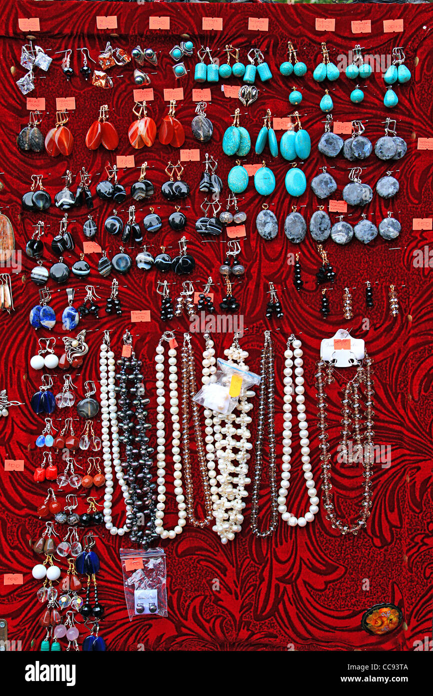 homemade valuables on red background Stock Photo - Alamy