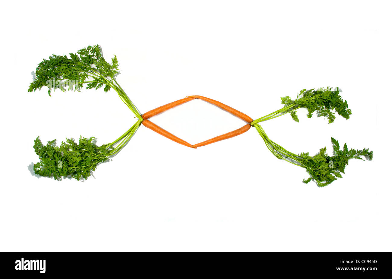 These 4 carrots form the shape of a diamond Stock Photo - Alamy