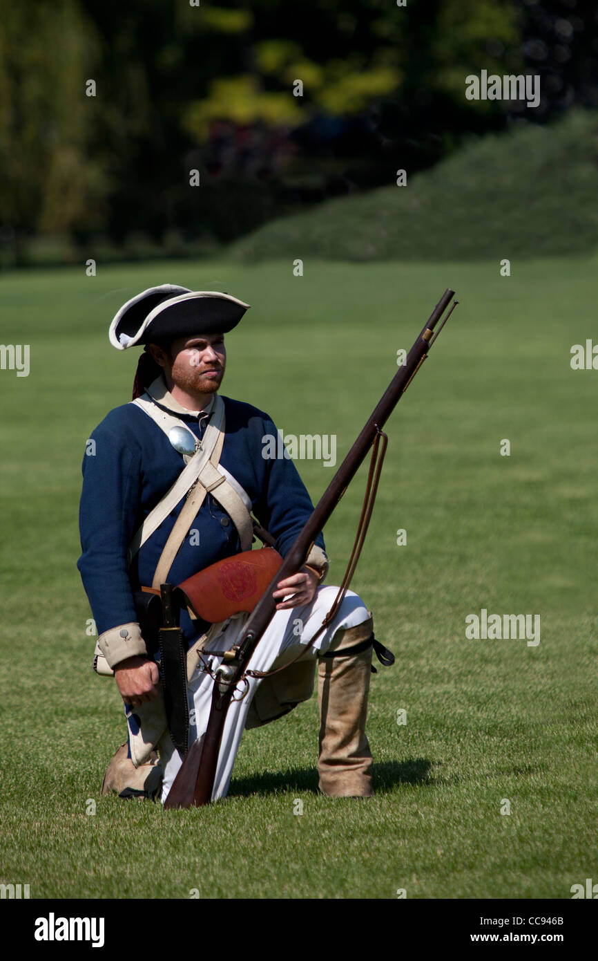 Union soldier resting with his rifle during a Civil War reenactment ...