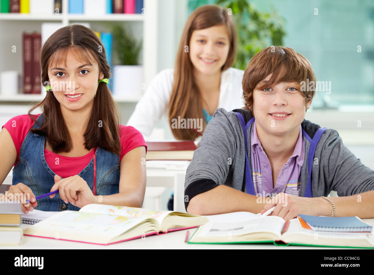 Portrait of smart classmates looking at camera during lesson Stock ...