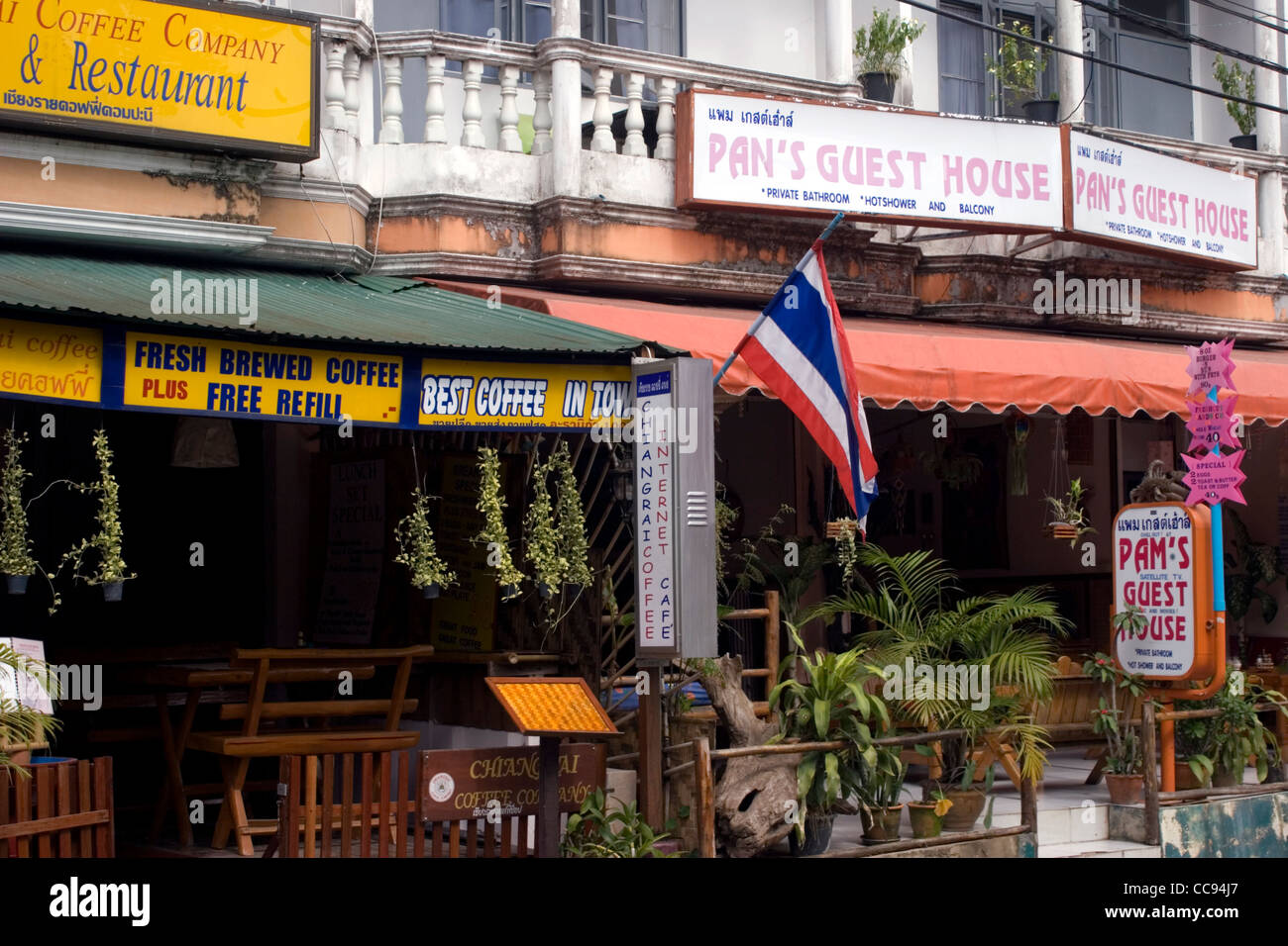 A coffee shop and a guest house are part of the urban landscape in ...