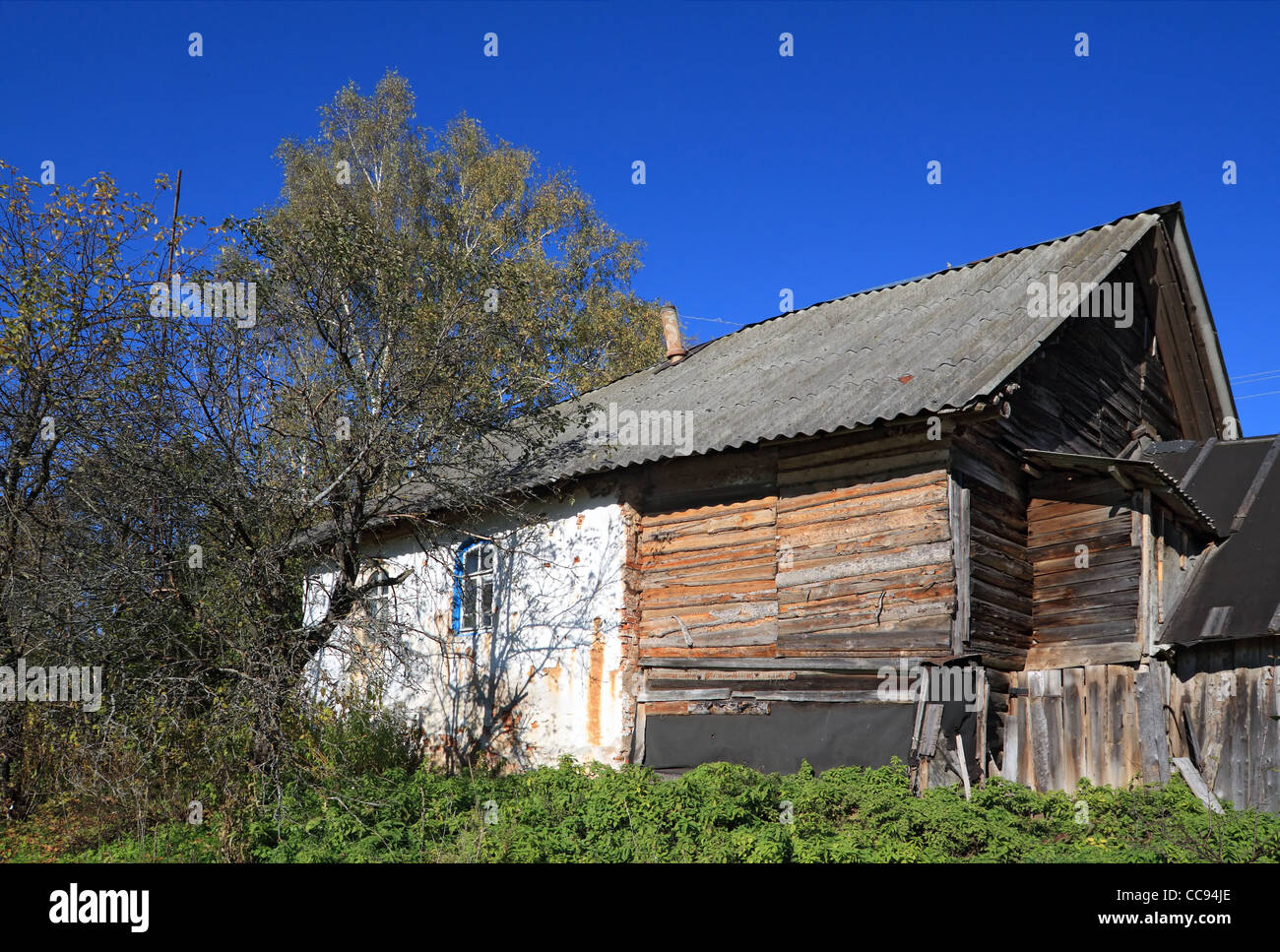 old wooden house in village Stock Photo - Alamy